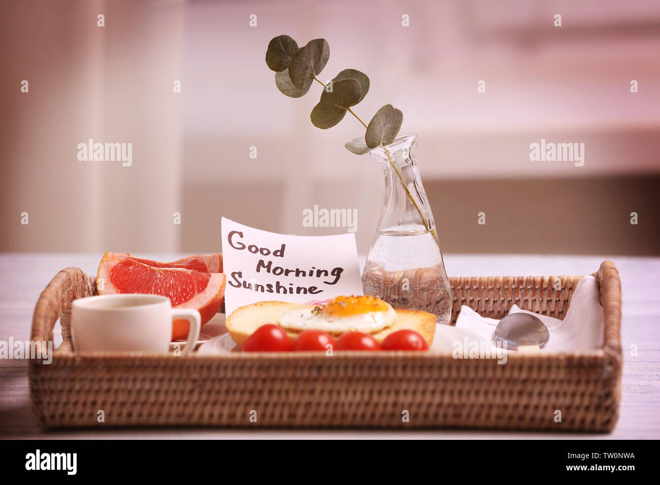 Delicious breakfast and GOOD MORNING greeting note on blurred ...