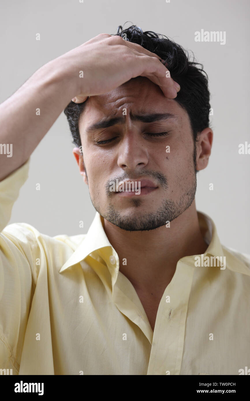 Man suffering from headache Stock Photo - Alamy
