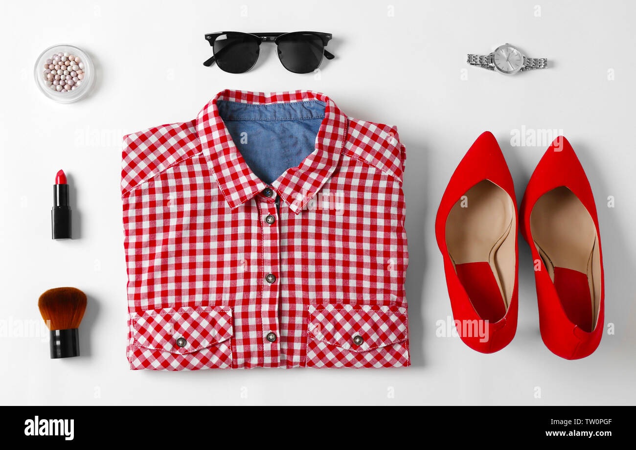Flat lay set of female clothes and accessories on white background ...