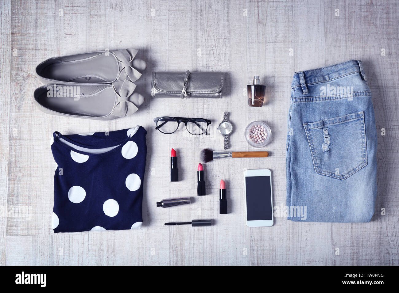 Flat lay set of female clothes on wooden background Stock Photo - Alamy