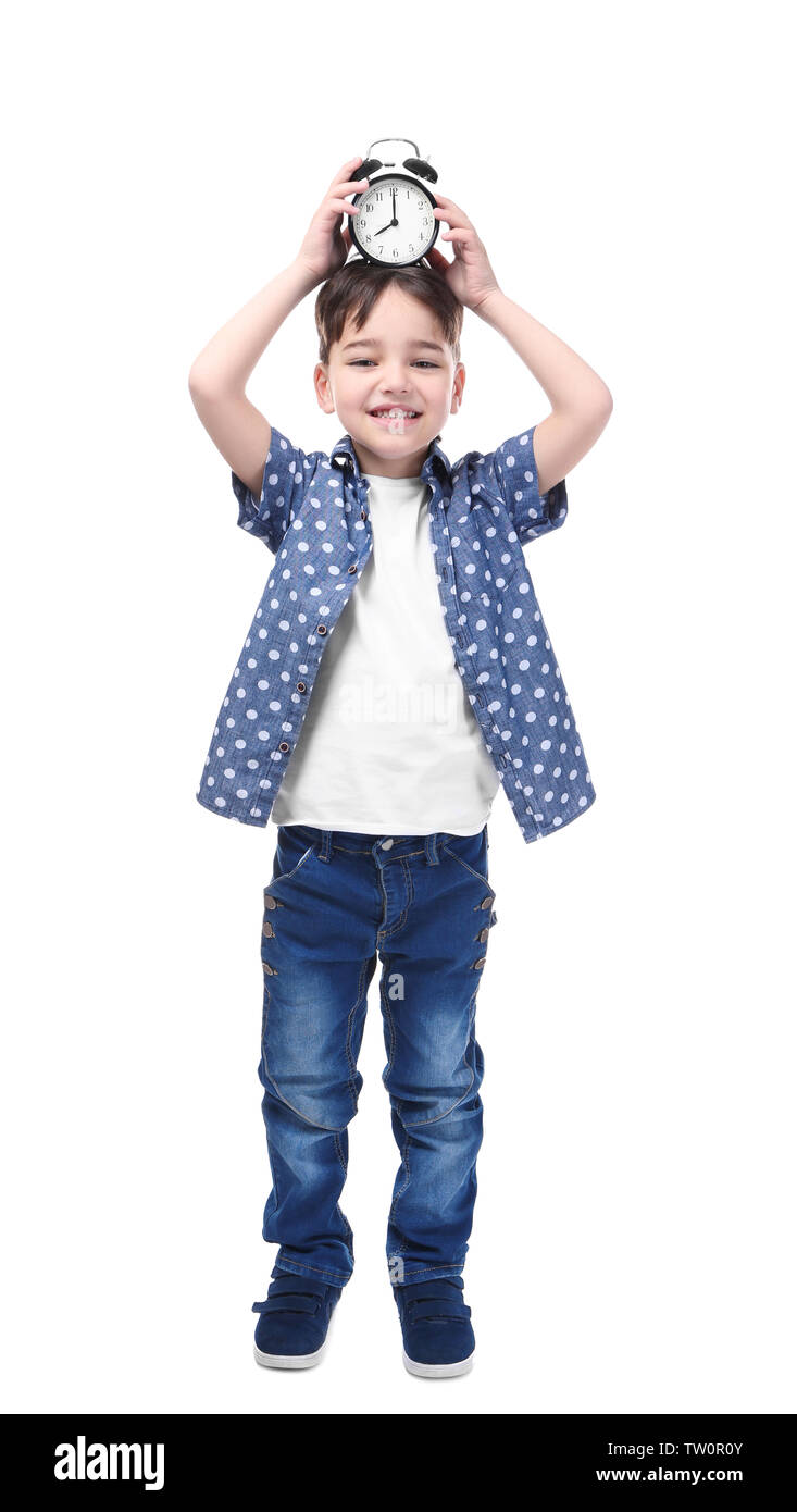 Cute little boy with alarm clock on white background Stock Photo - Alamy