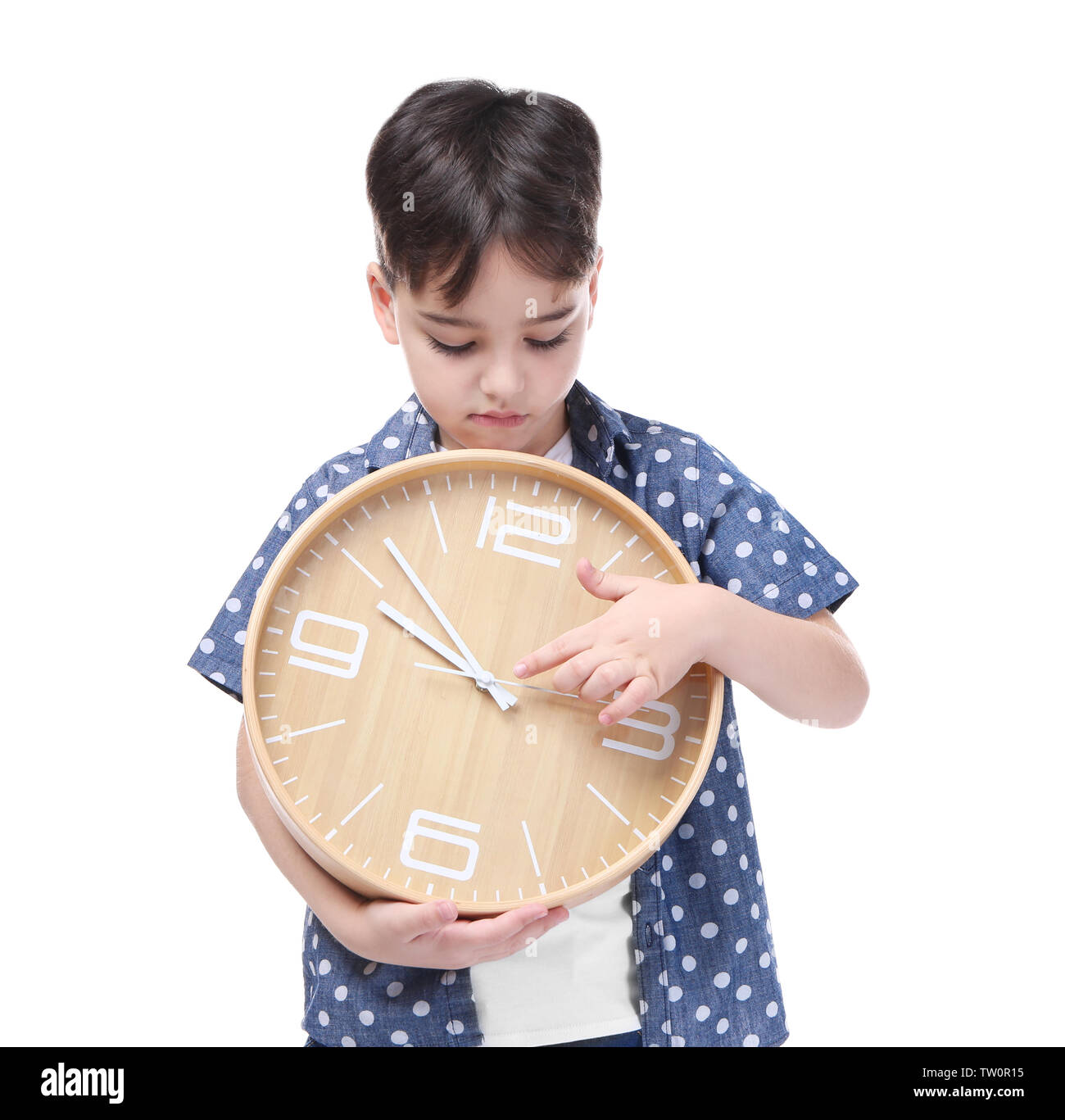Cute little boy with big clock on white background Stock Photo - Alamy