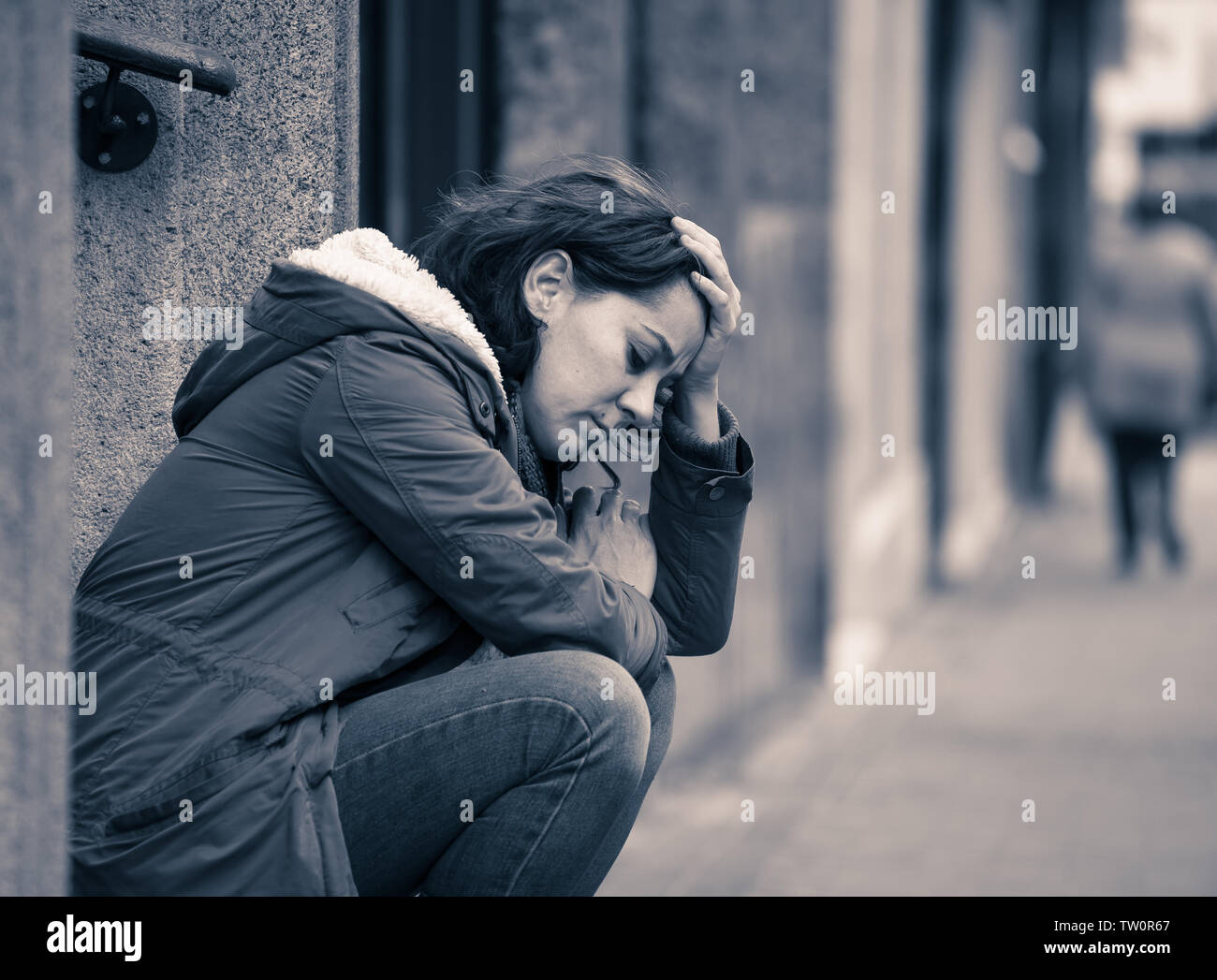 Attractive woman suffering from depression felling sad unhappy ...