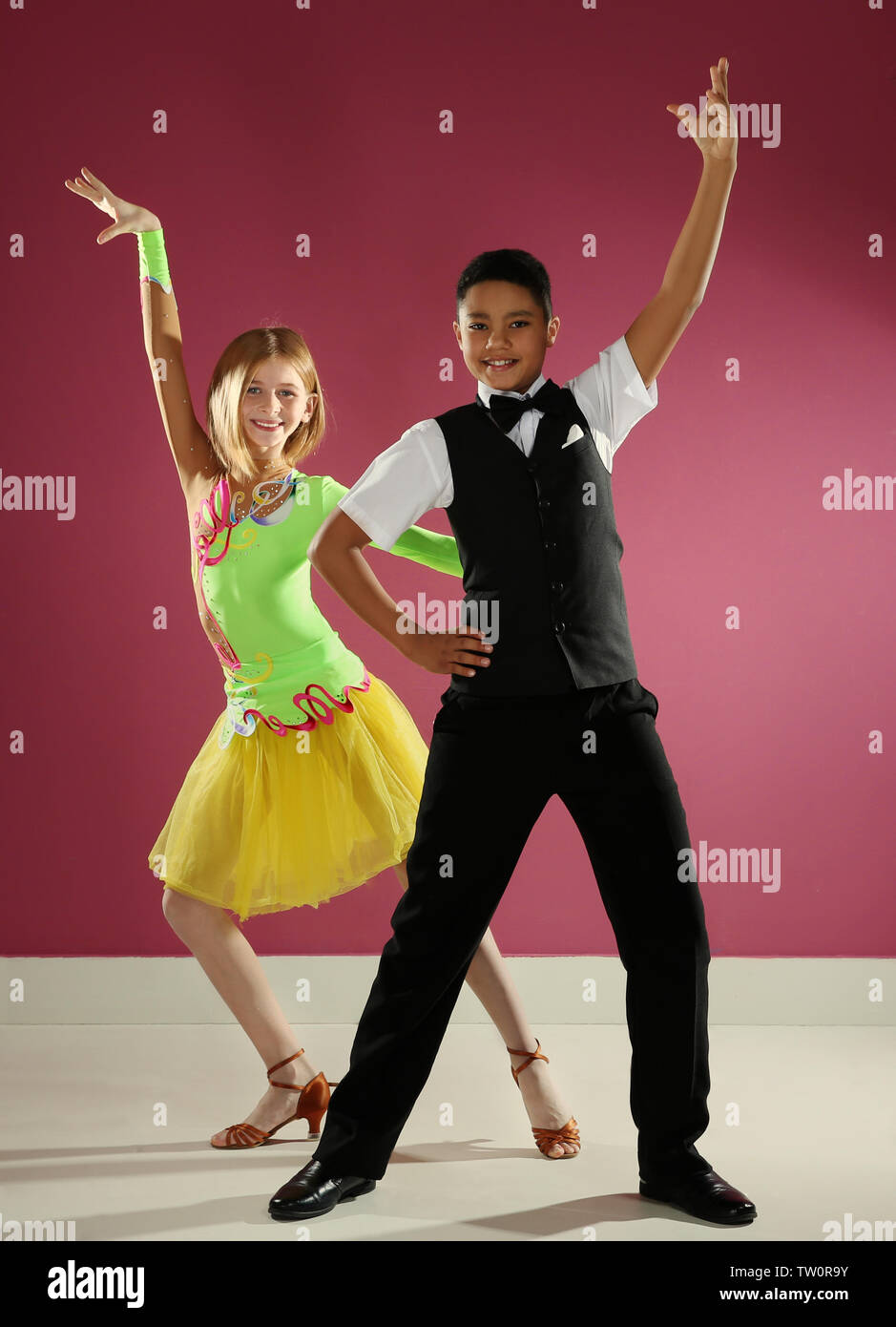 Cute dancing children on colorful background Stock Photo - Alamy