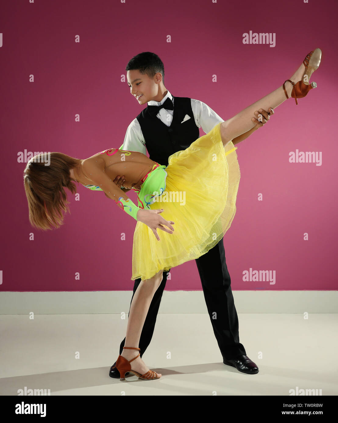 Cute dancing children on colorful background Stock Photo - Alamy