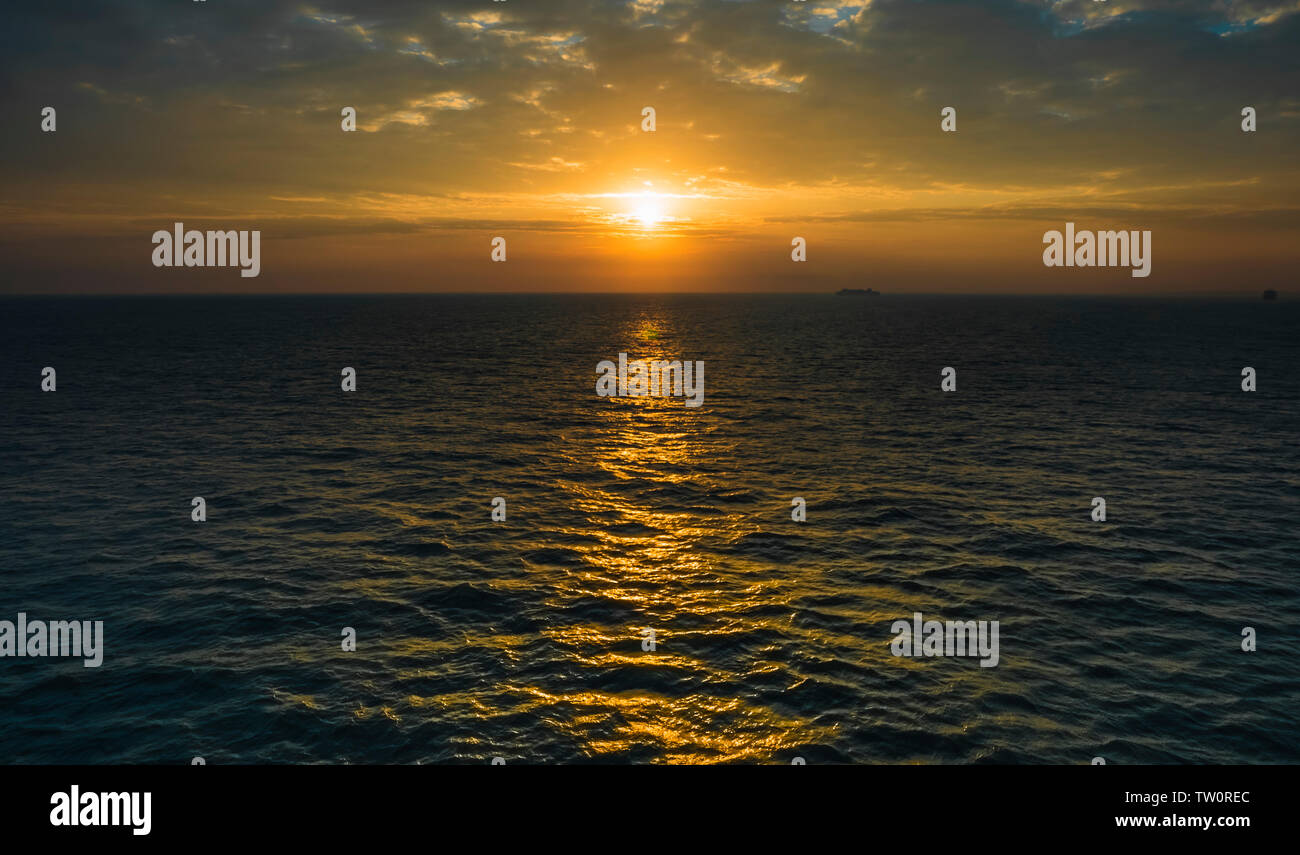 Sunset sea level Stock Photo - Alamy
