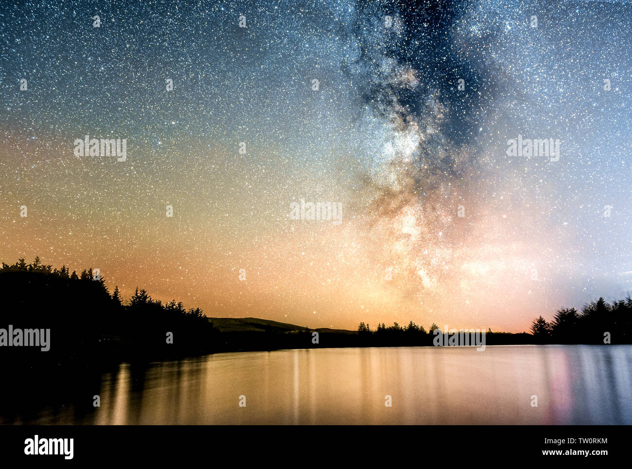 Milky way over a lake Stock Photo - Alamy
