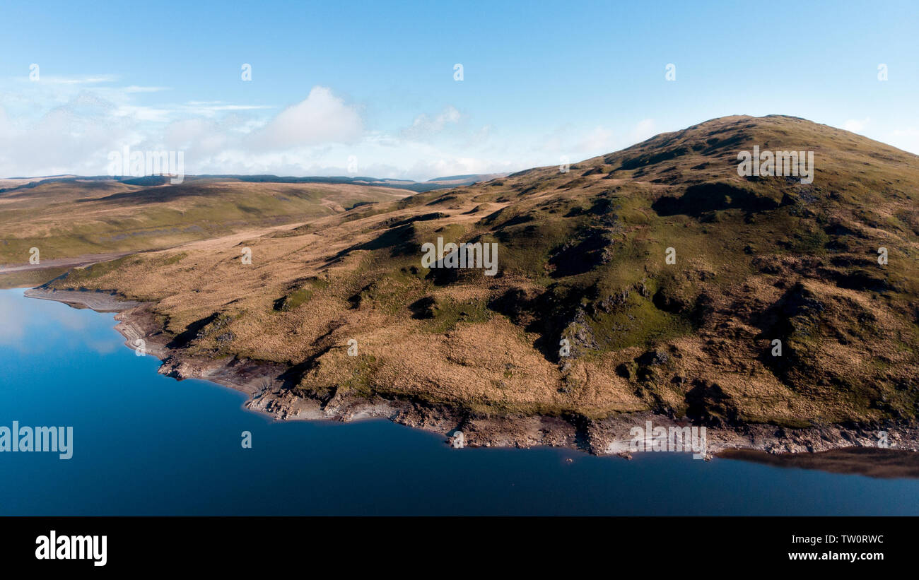 Drone photo of a mountain and reservoir Stock Photo - Alamy