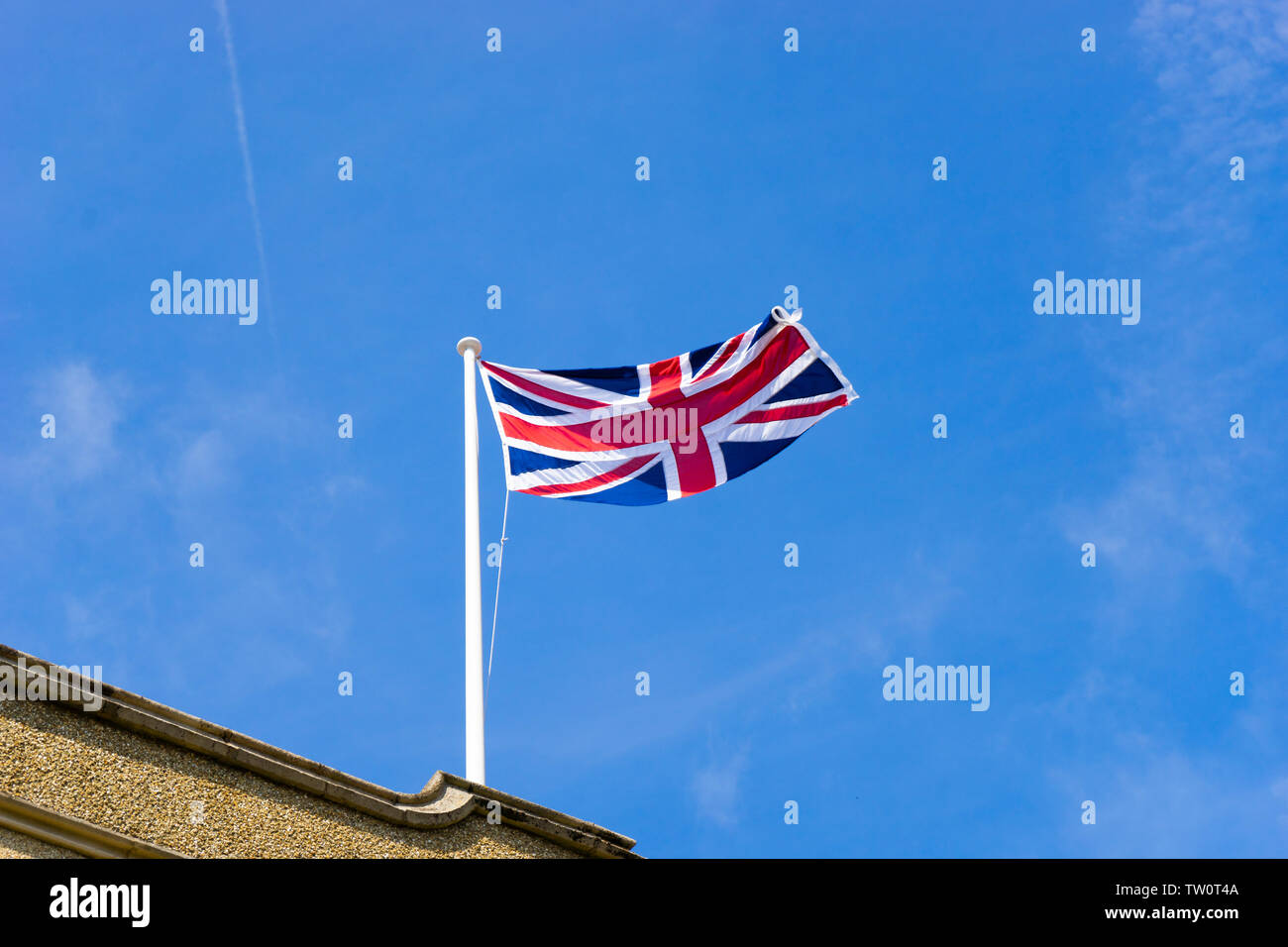Union Jack flying in the sky on a summer afternoon Stock Photo - Alamy