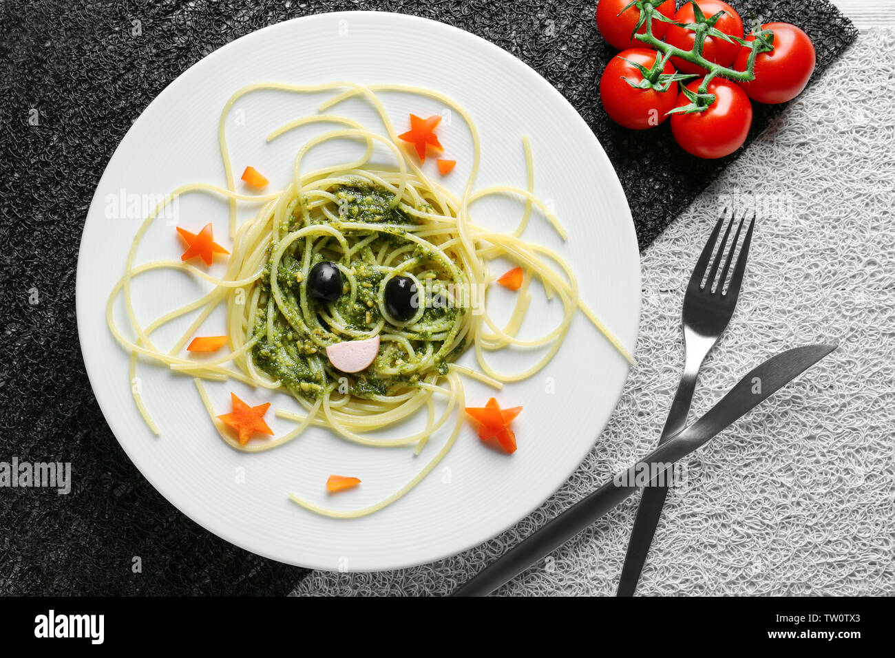 Plate with creative pasta for children on table Stock Photo - Alamy