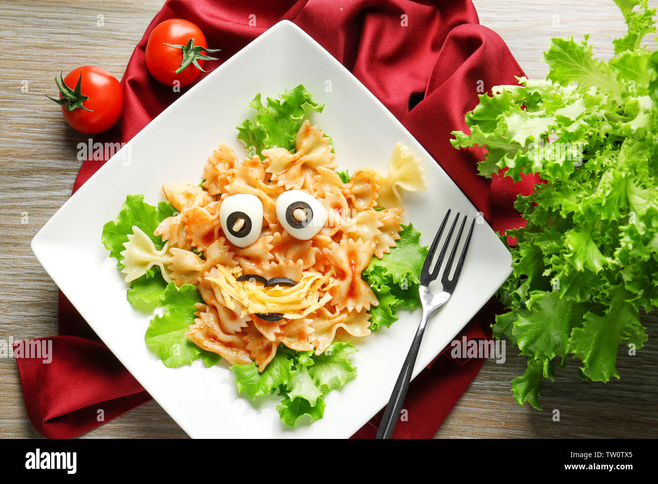 Plate with creative pasta for children on table Stock Photo - Alamy