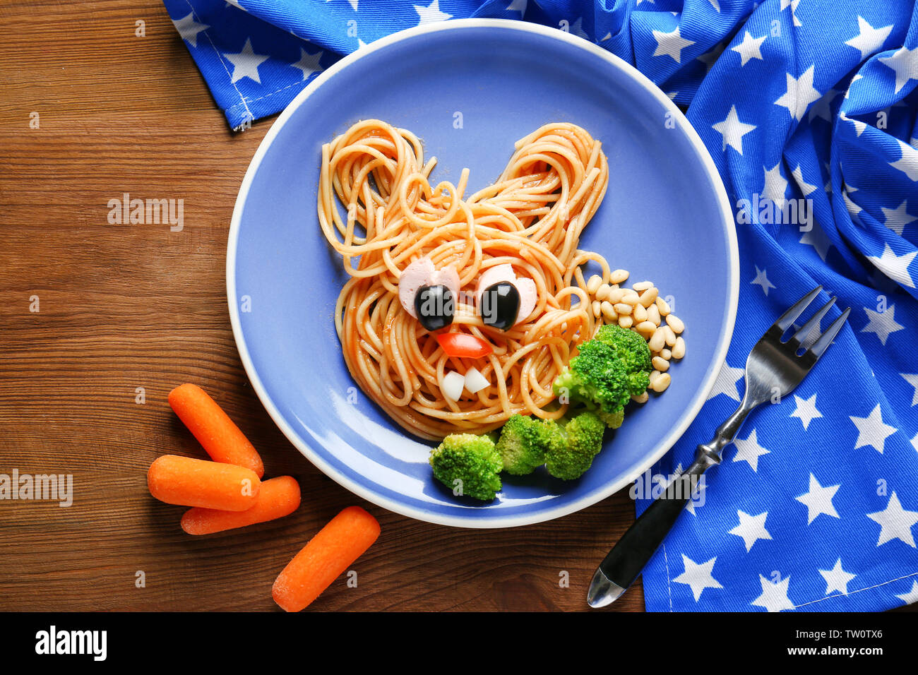 Plate with creative pasta for children on table Stock Photo - Alamy