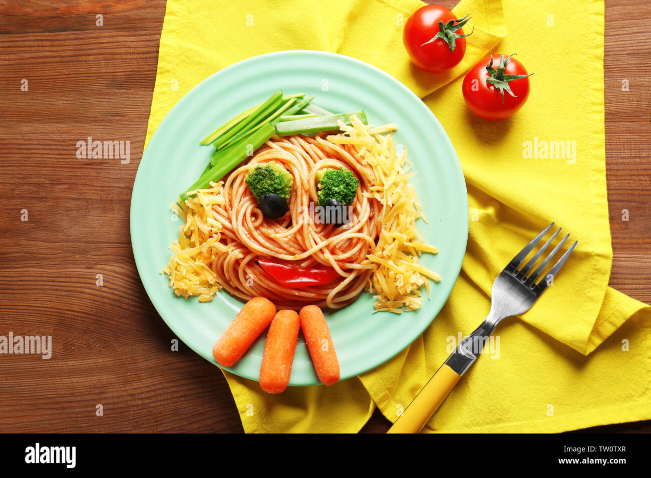 Plate with creative pasta for children on table Stock Photo - Alamy