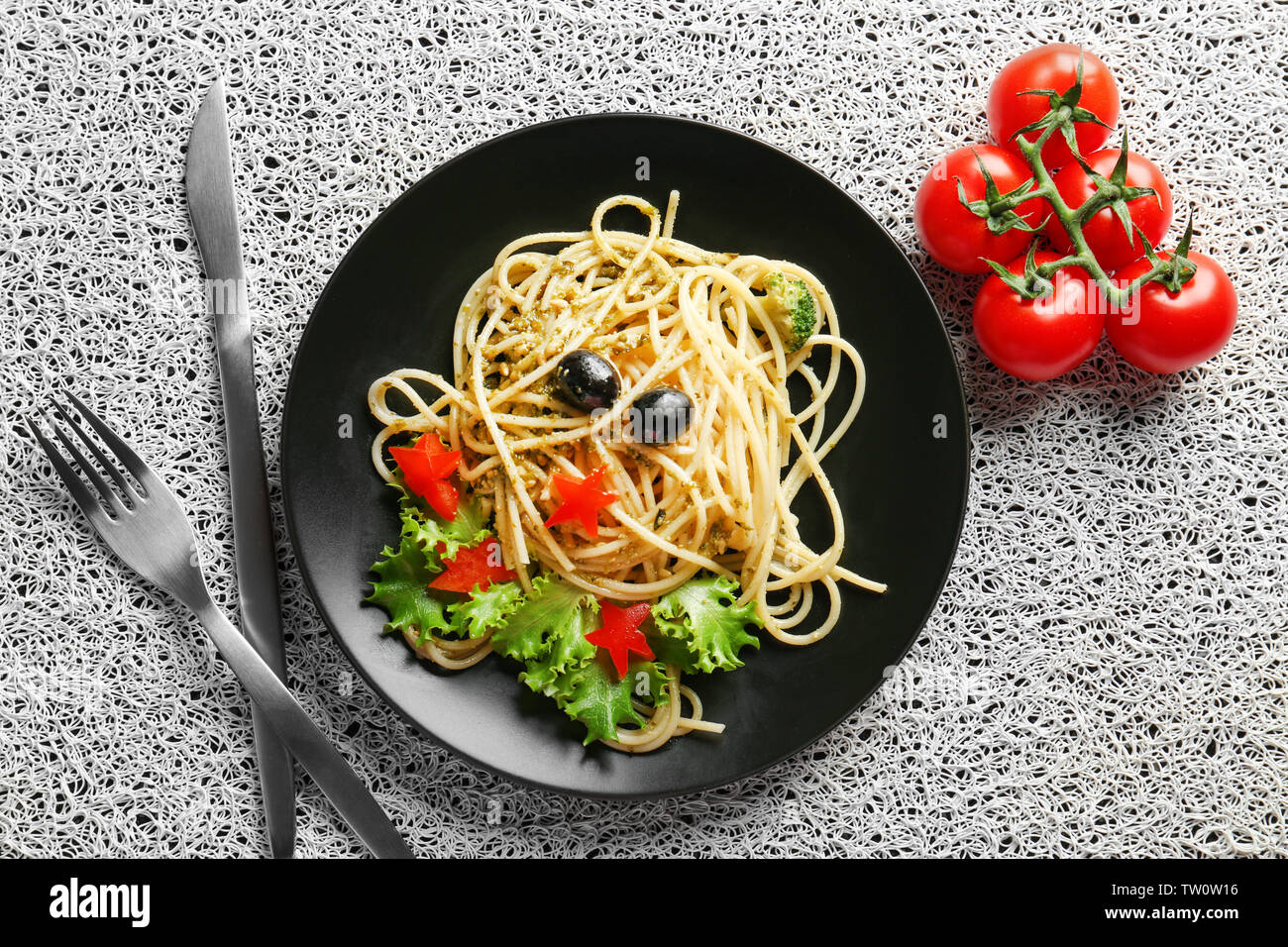 Plate with creative pasta for children on table Stock Photo - Alamy