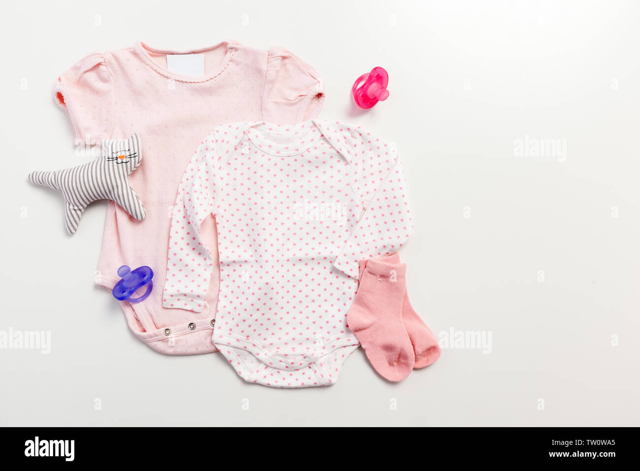 Set of clothing and items for a baby Stock Photo - Alamy