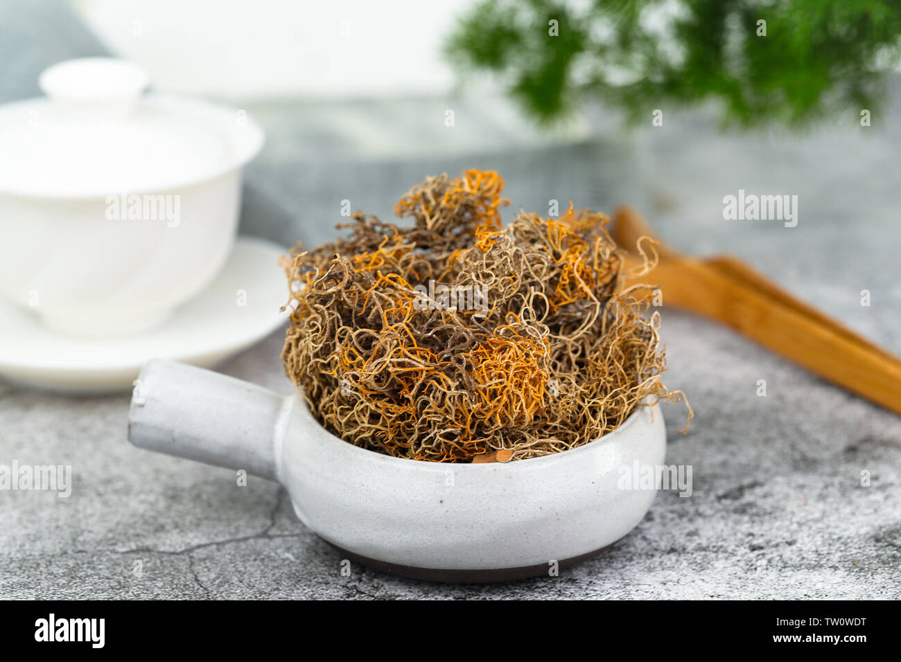 Black snow tea Stock Photo - Alamy