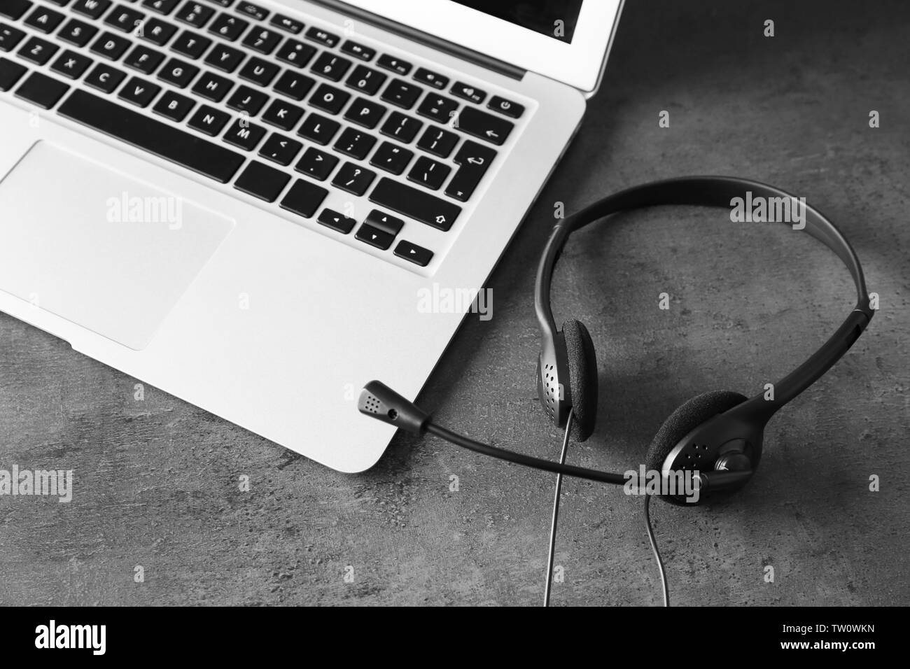 Wireless headphones on laptop Black and White Stock Photos & Images - Alamy