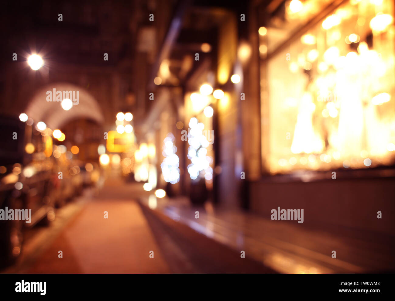 Blurred view of modern clothes shops on street Stock Photo - Alamy