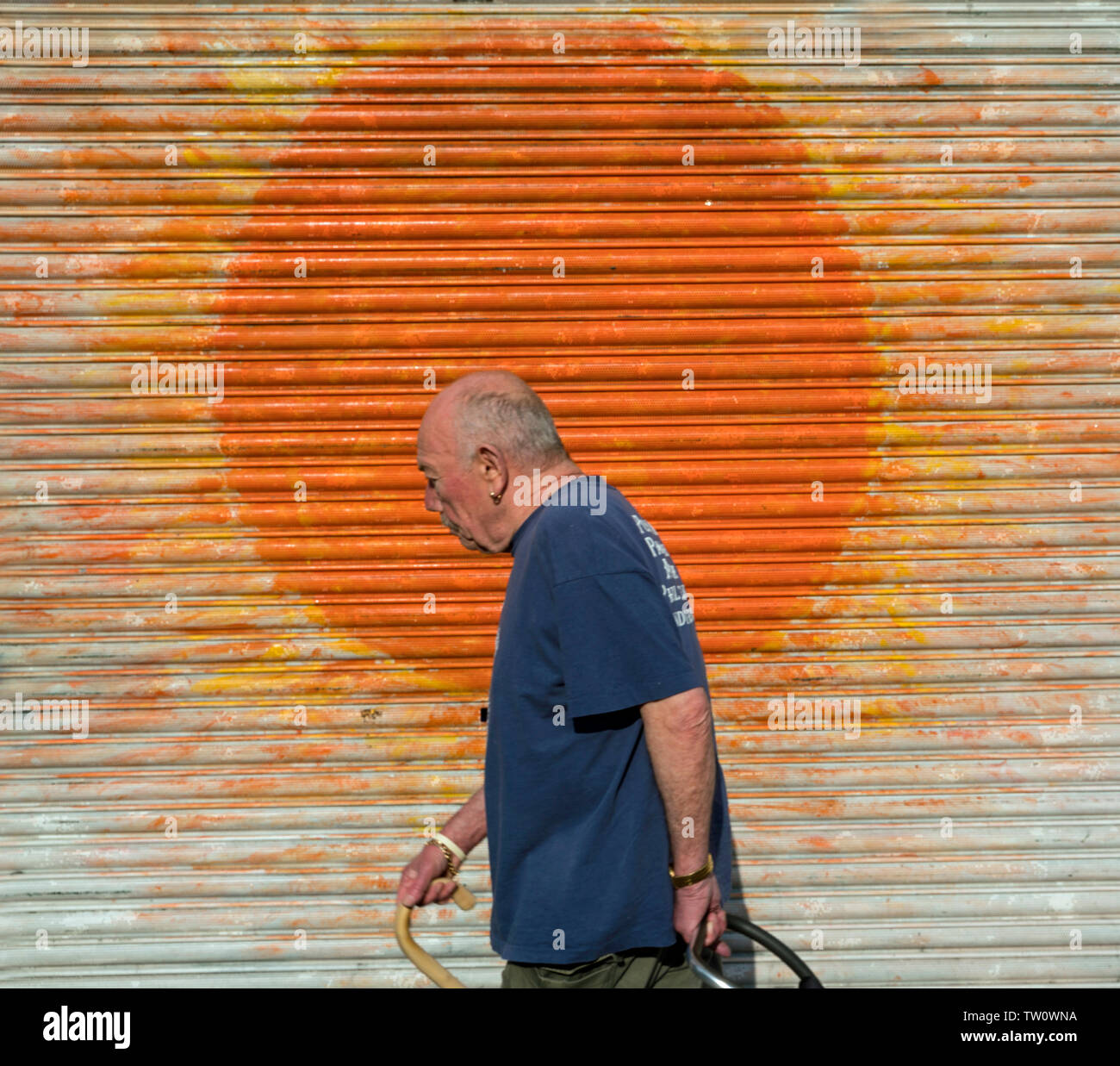 Man Walking Past The Sun Stock Photo - Alamy