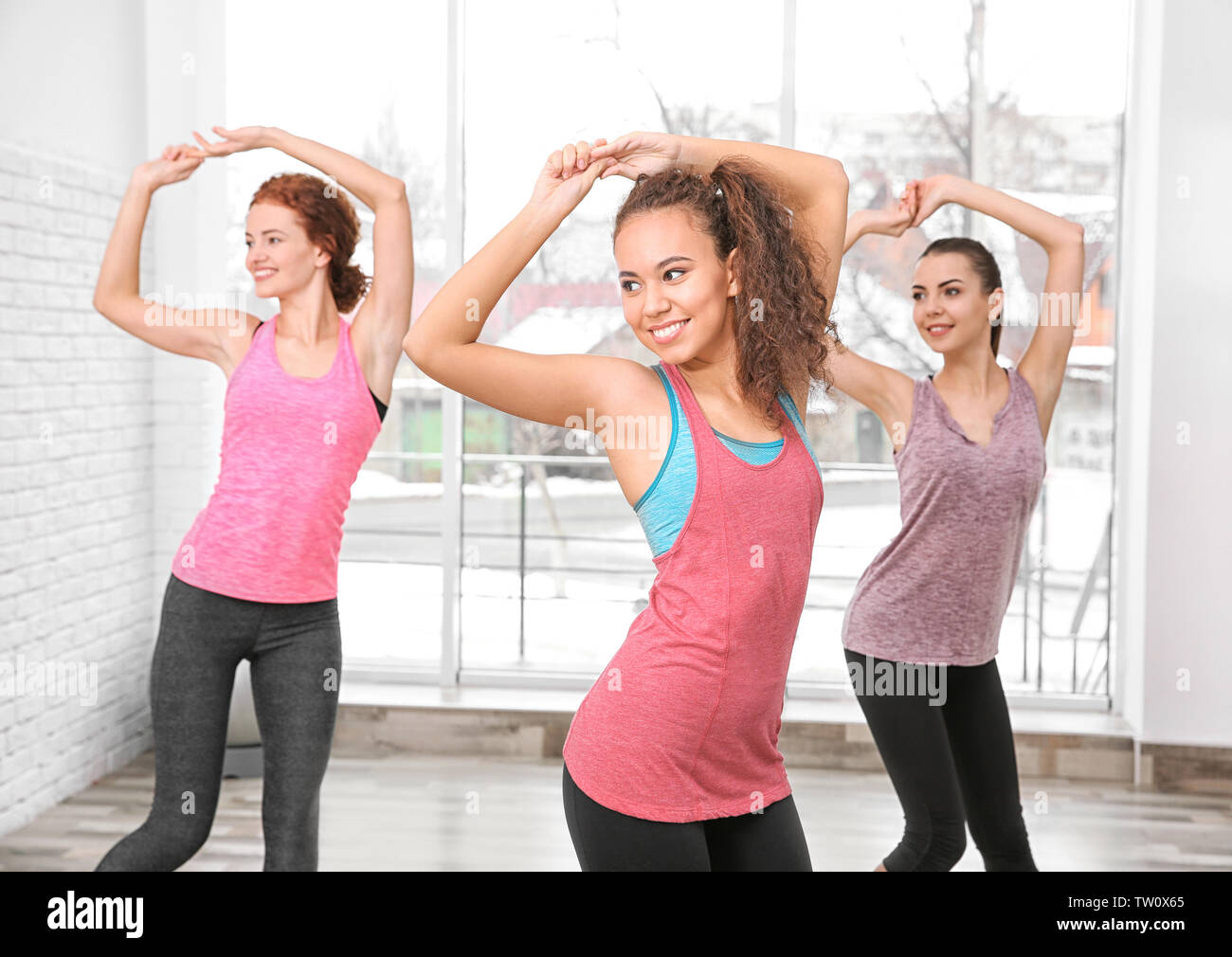 Beautiful girls training in gym Stock Photo - Alamy