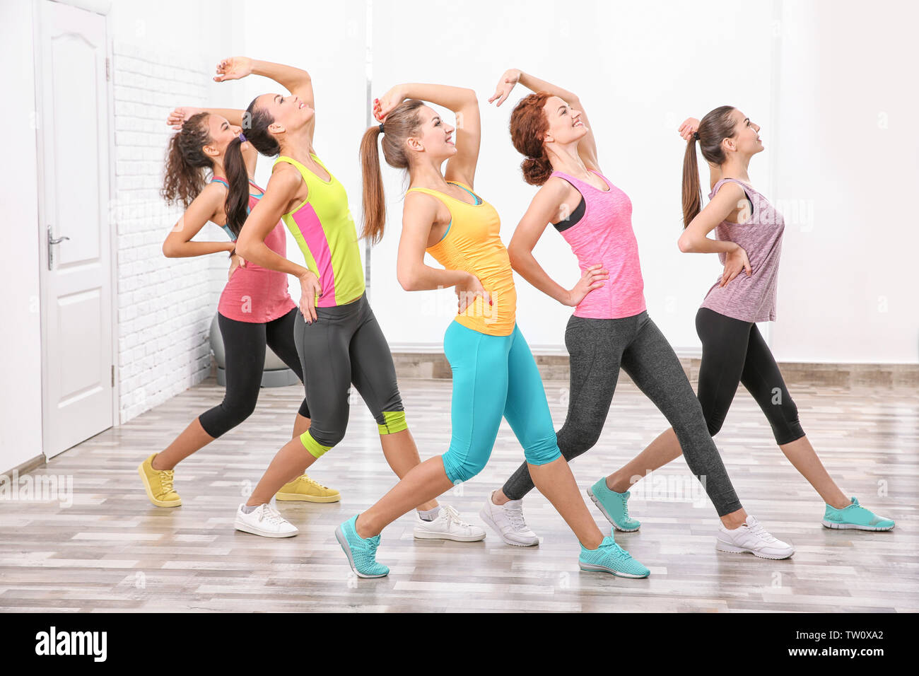 Beautiful girls training in gym Stock Photo - Alamy