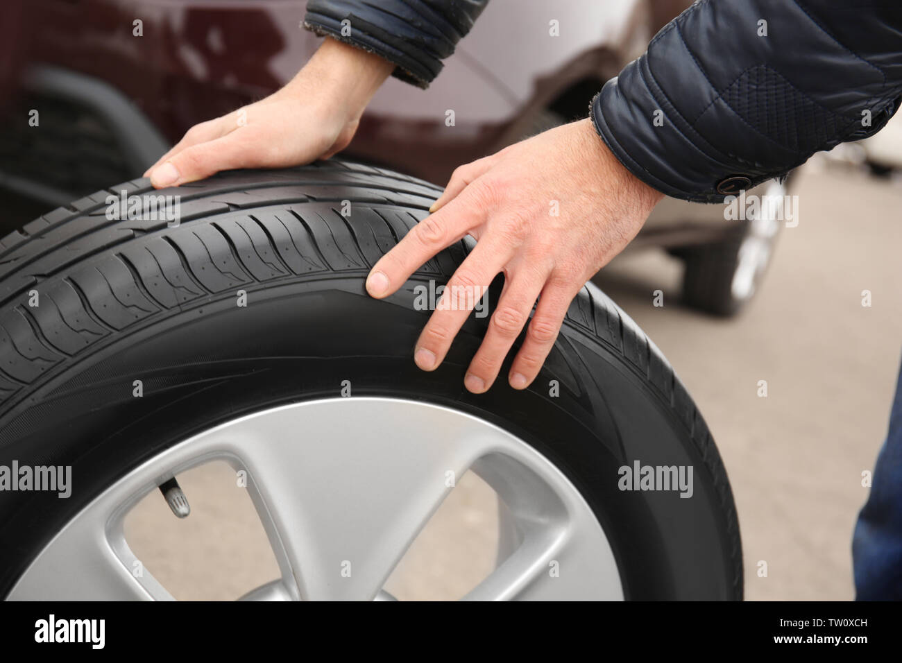 Closeup view of man rolling wheel outdoors Stock Photo - Alamy