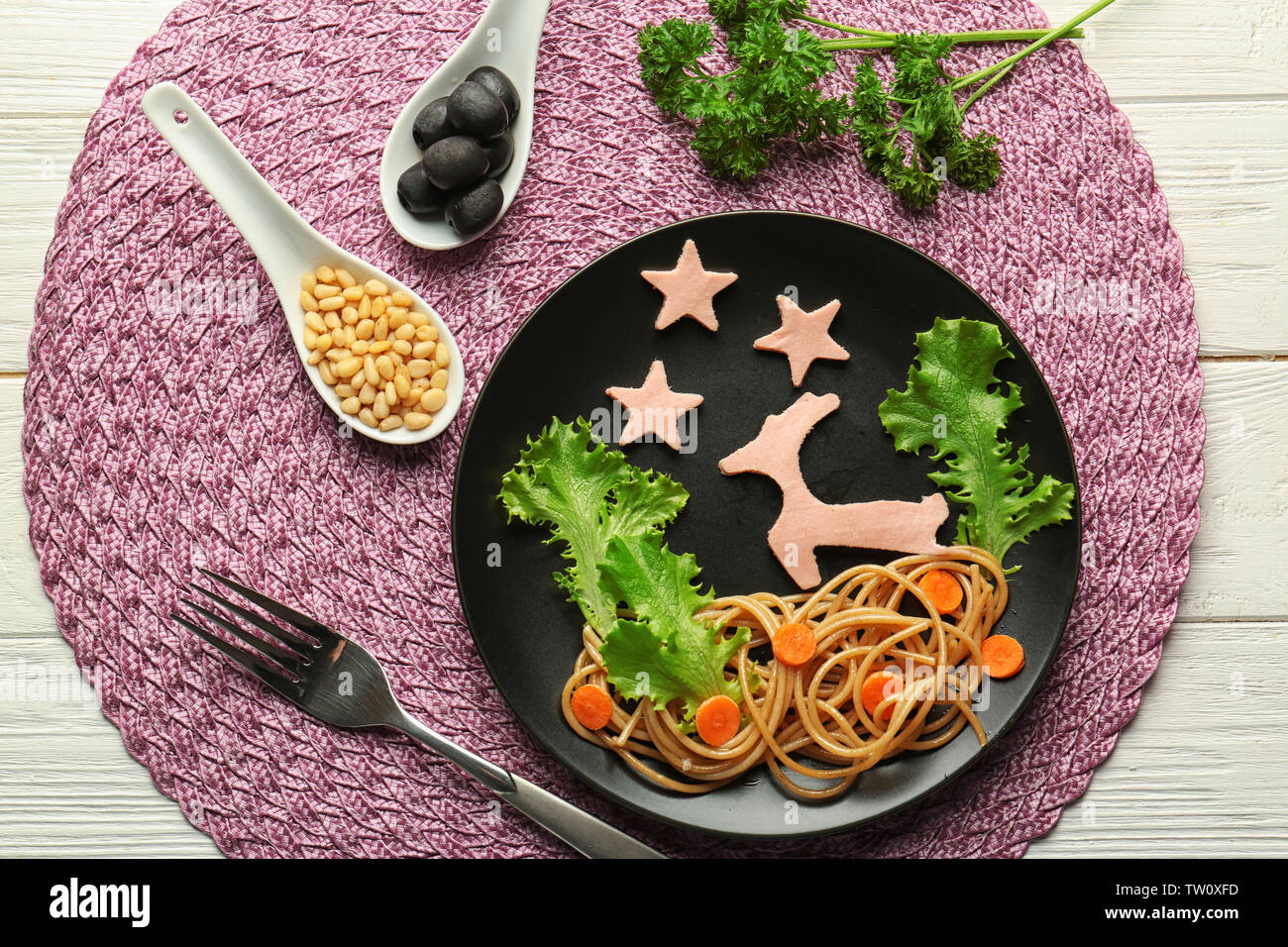 Plate with creative pasta for children on wicker mat Stock Photo - Alamy