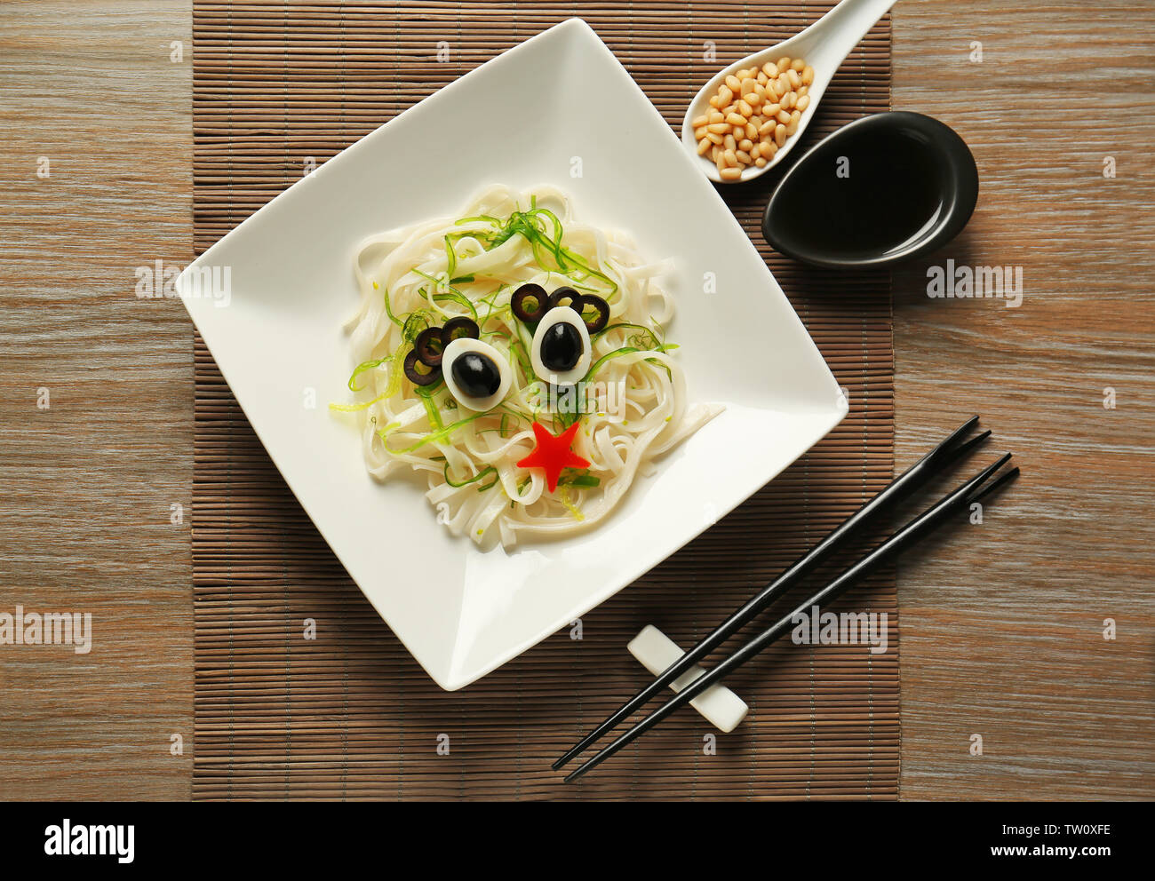Plate with creative pasta for children on wooden background Stock Photo ...