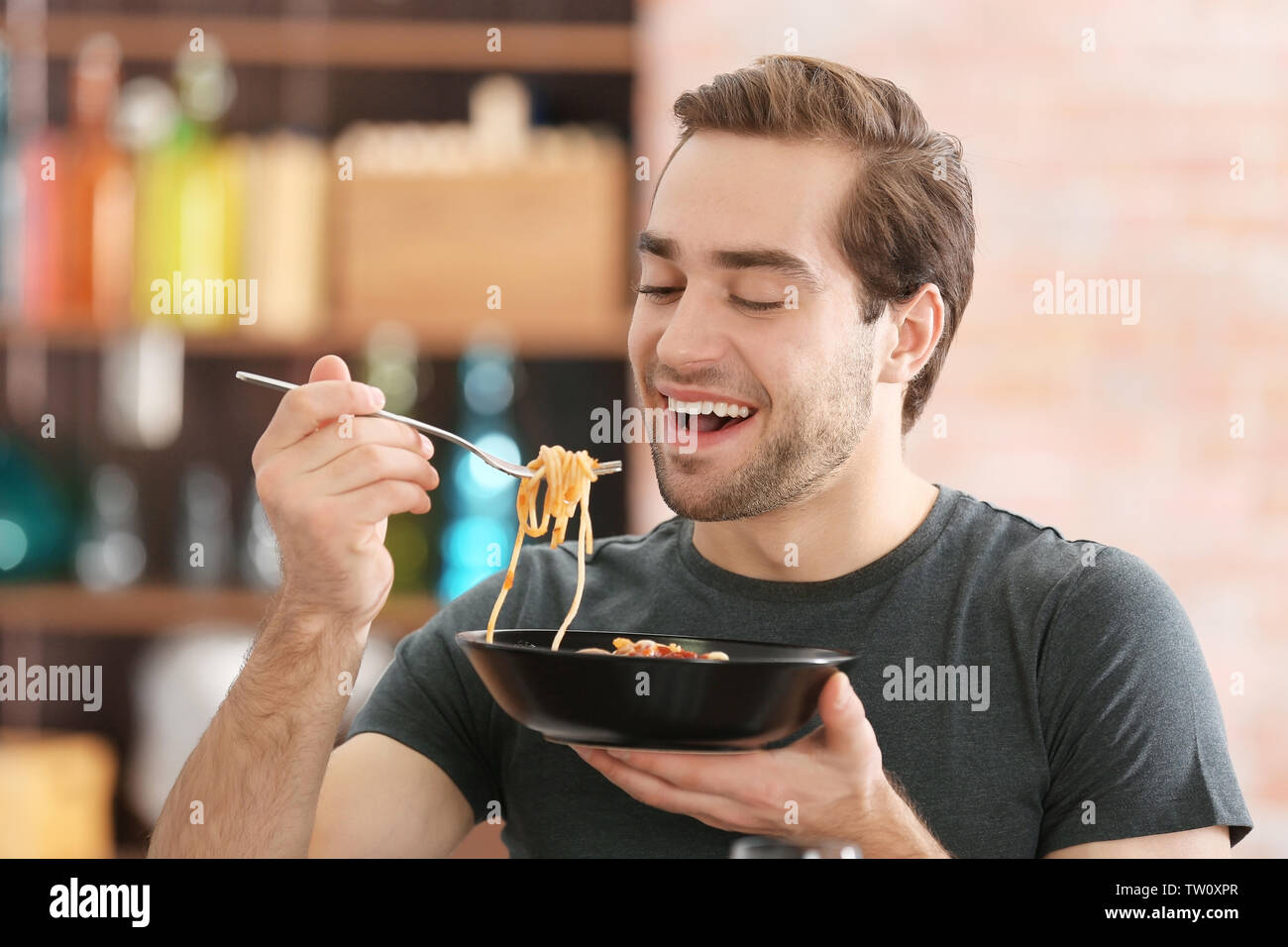 Adult eating spaghetti at home hi-res stock photography and images - Alamy