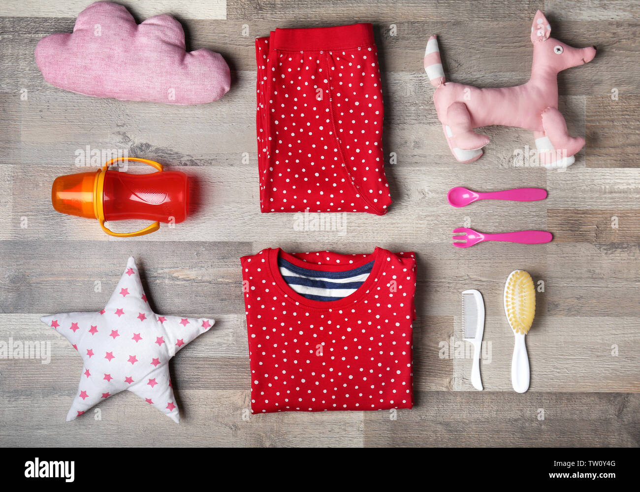 Baby clothes and accessories on wooden background Stock Photo - Alamy