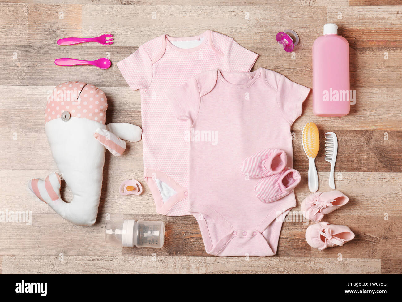 Baby clothes and accessories on wooden background Stock Photo - Alamy