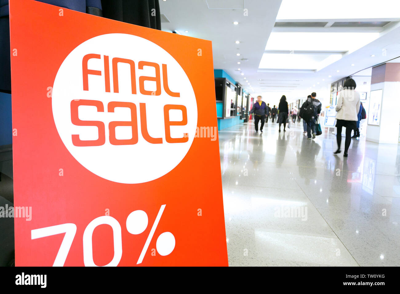 sale poster board at fashion clothes shopfront Stock Photo - Alamy