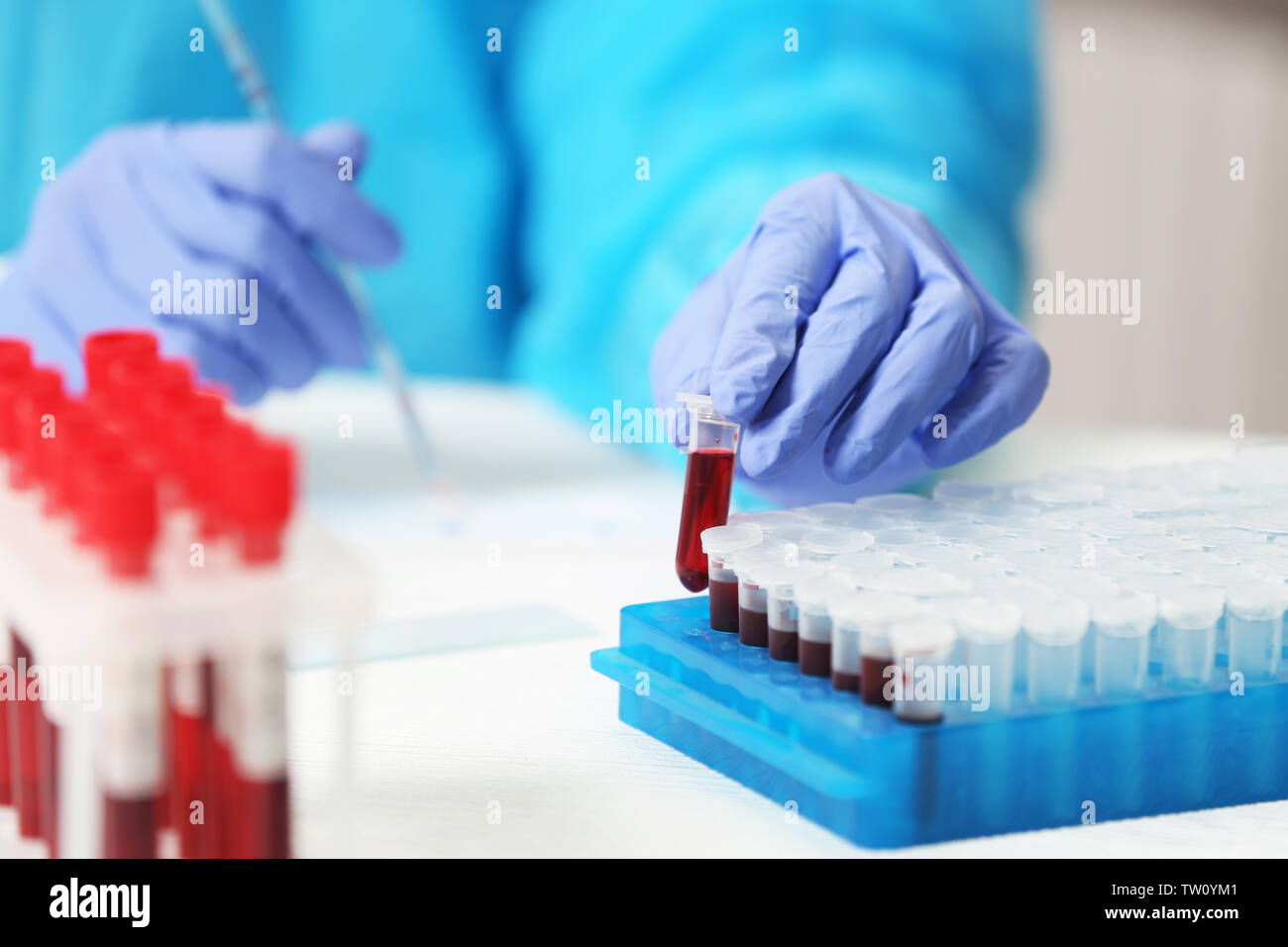 Scientist working with blood sample in laboratory Stock Photo - Alamy