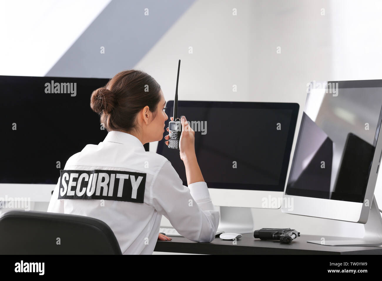 Female security guard on workplace Stock Photo - Alamy