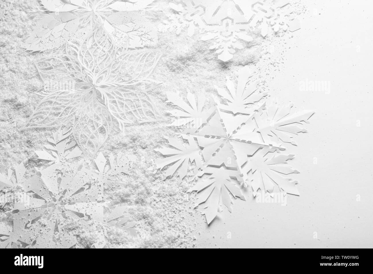 Beautiful paper snowflakes and snow on white background Stock Photo - Alamy