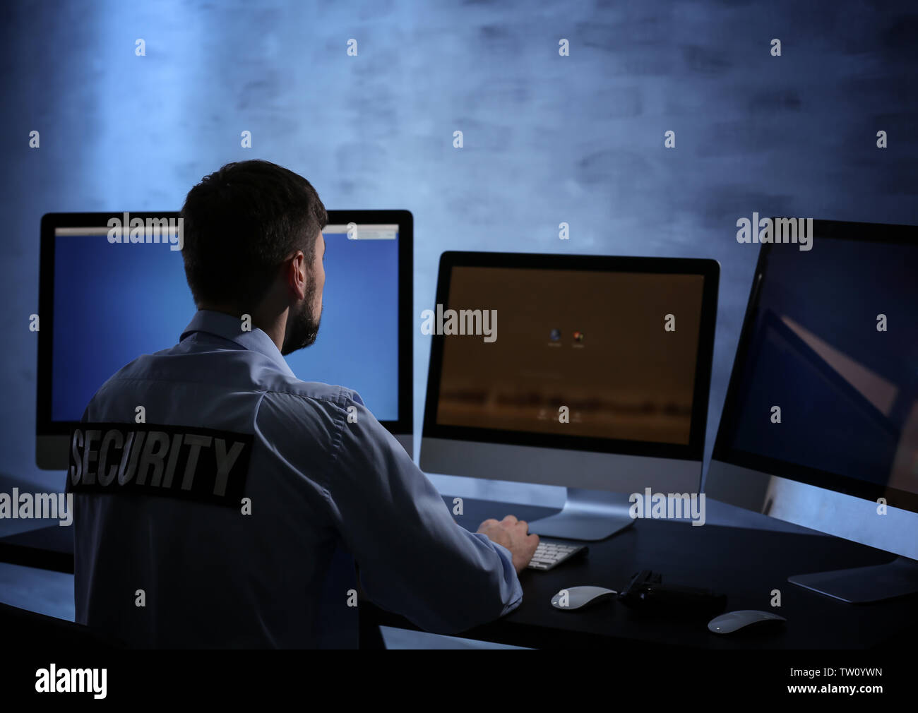 Male security guard on workplace Stock Photo - Alamy