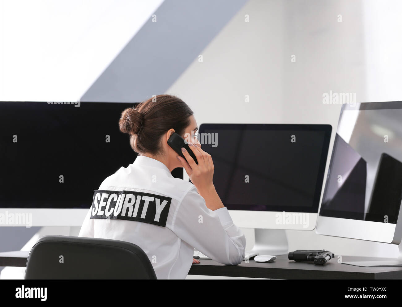 Female security guard on workplace Stock Photo - Alamy