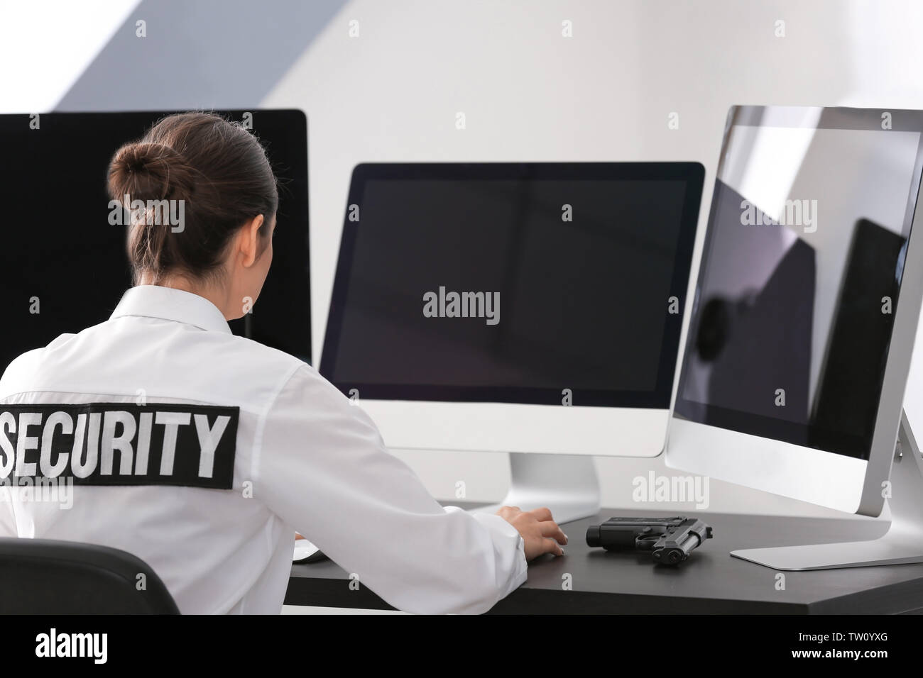 Female security guard on workplace Stock Photo - Alamy