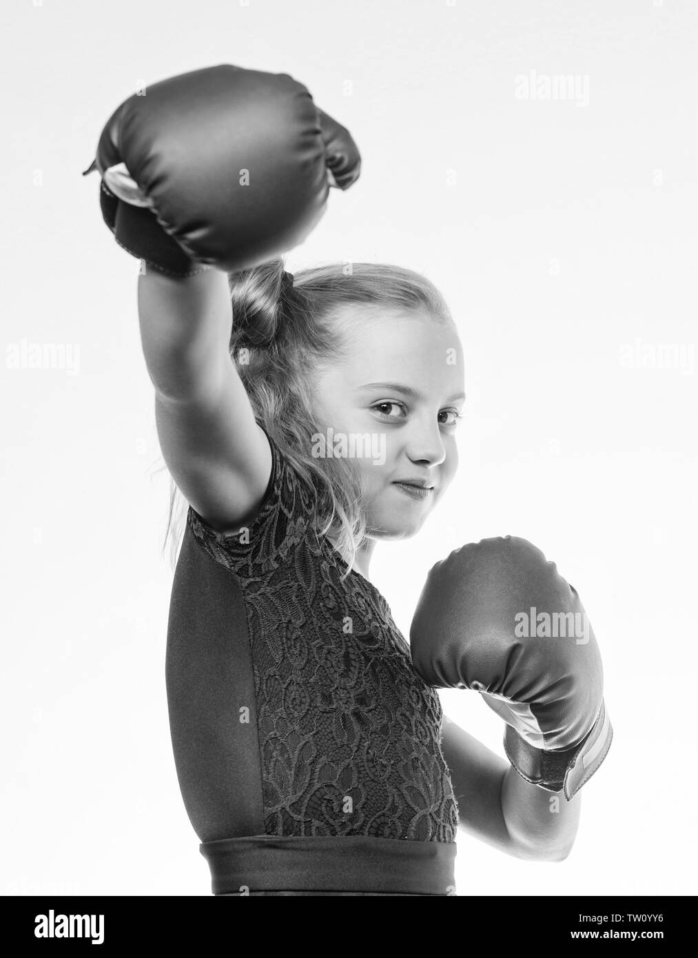 little girl in boxing gloves punching. training with coach. Fight ...