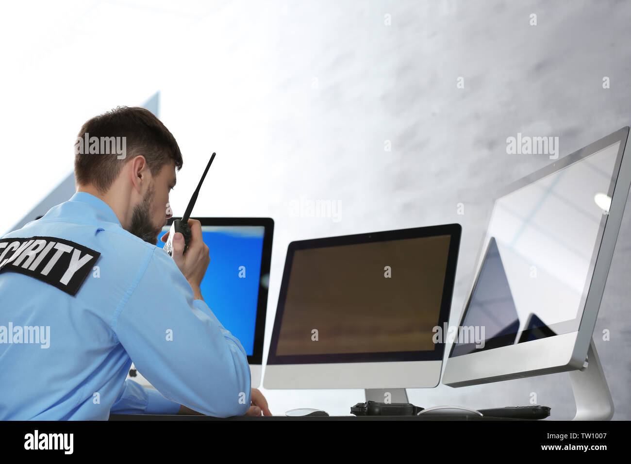 Male security guard on workplace Stock Photo - Alamy