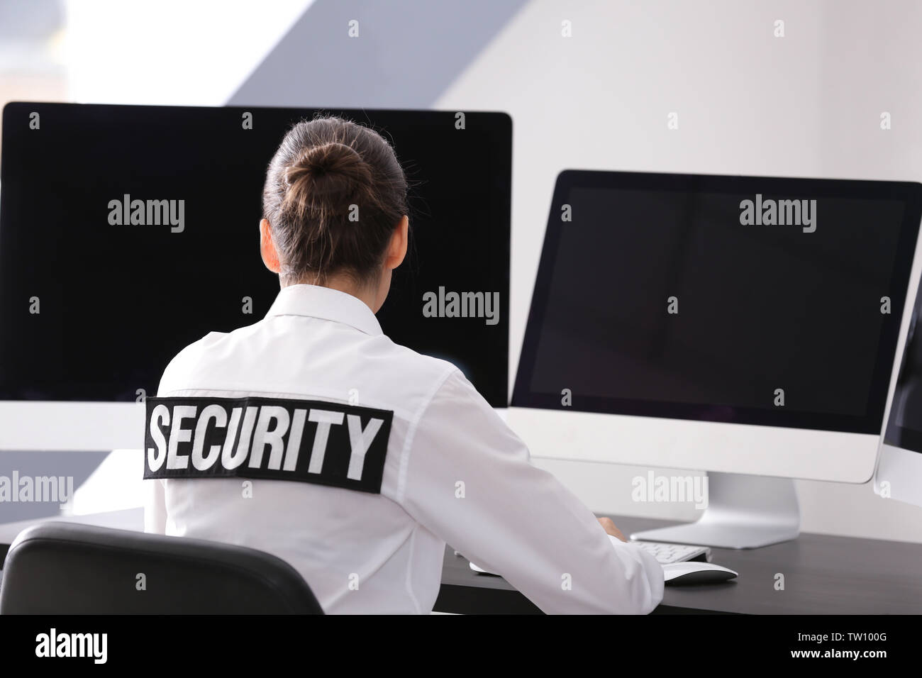 Female security guard on workplace Stock Photo - Alamy