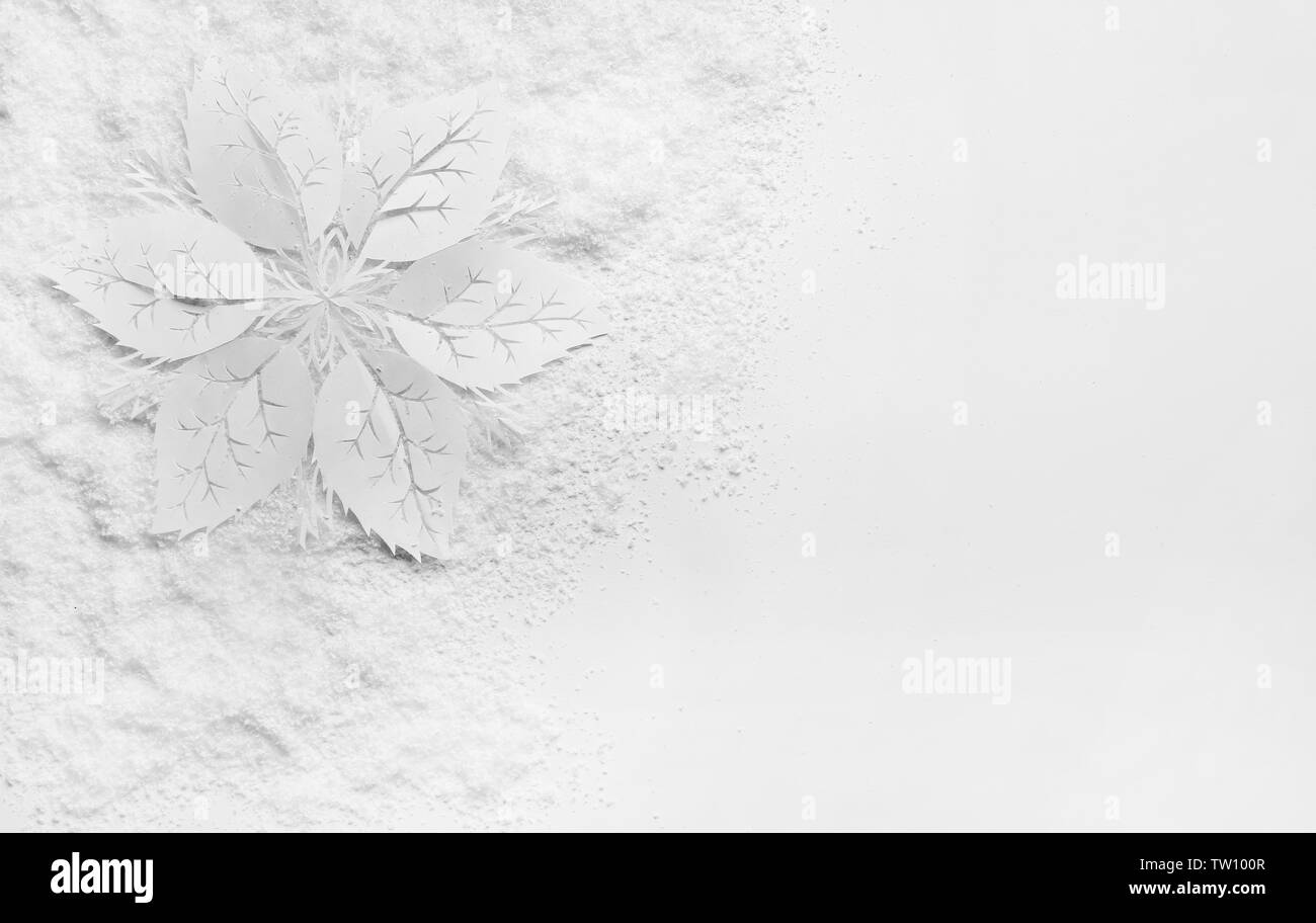 Beautiful paper snowflake and snow on white background Stock Photo - Alamy