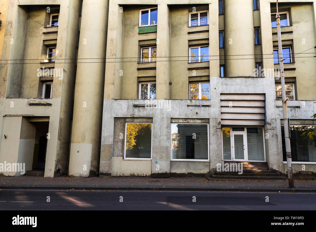 Old weathered street wall with some windows and doors Stock Photo - Alamy