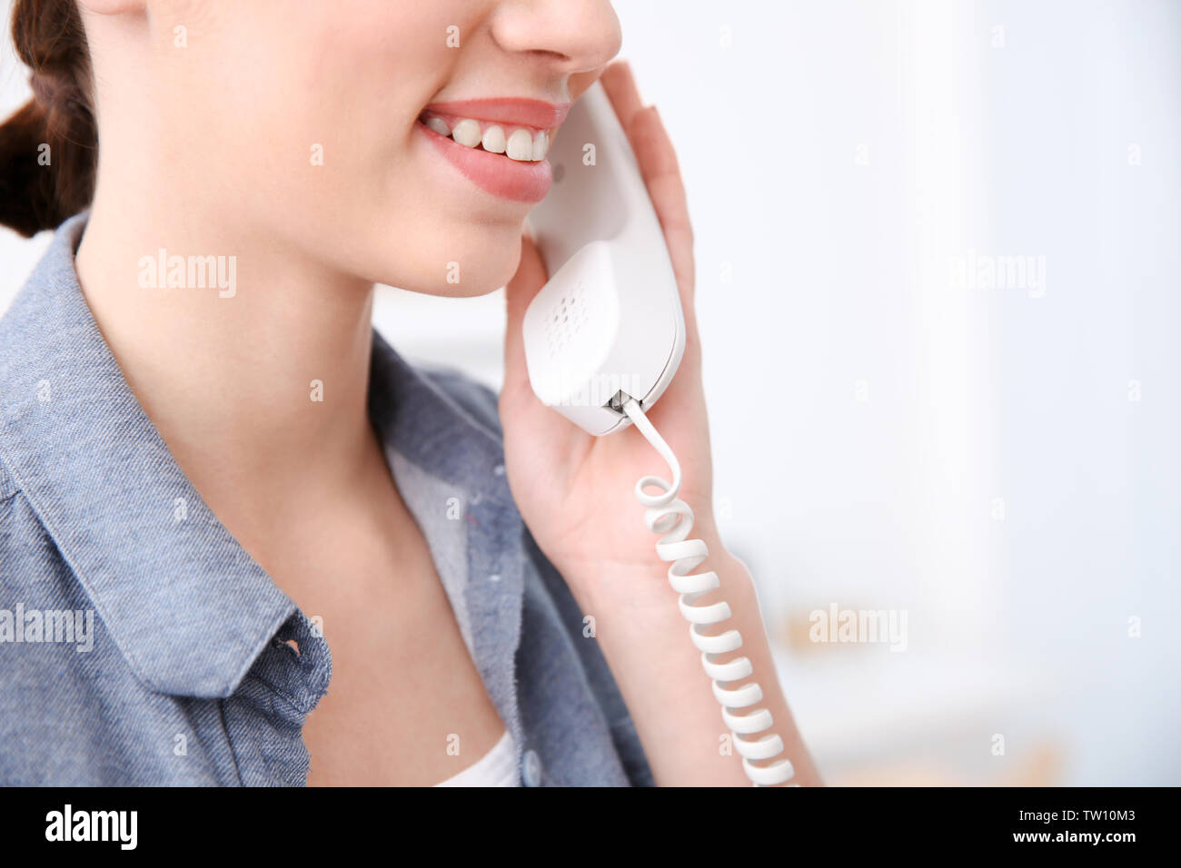 Beautiful young woman talking by telephone, closeup Stock Photo - Alamy