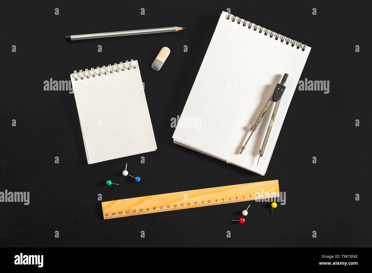 Engineering compass with white paper Stock Photo - Alamy