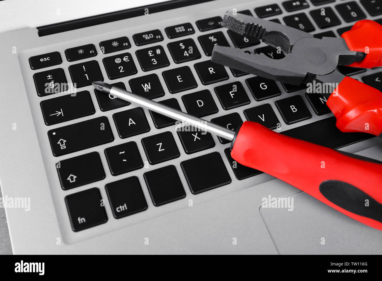 Instruments on laptop keyboard, closeup Stock Photo - Alamy