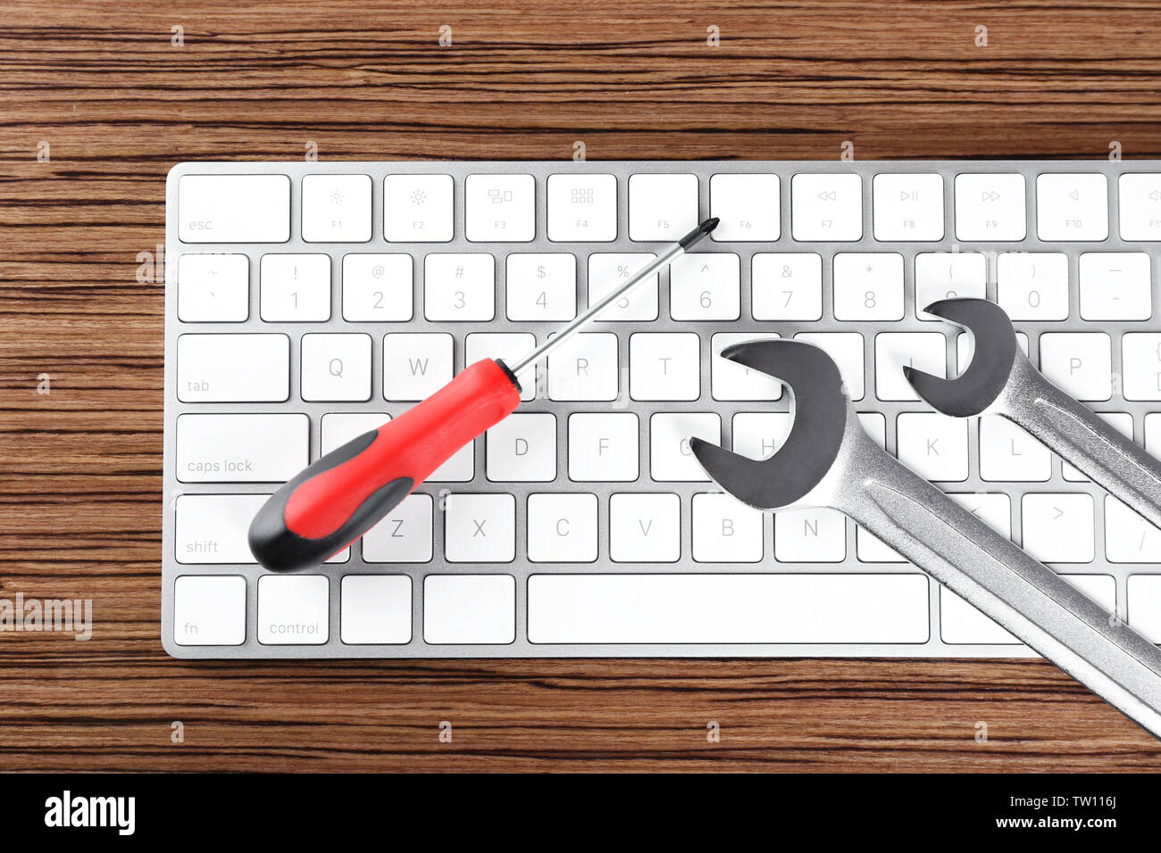 Computer keyboard with instruments on wooden table Stock Photo - Alamy