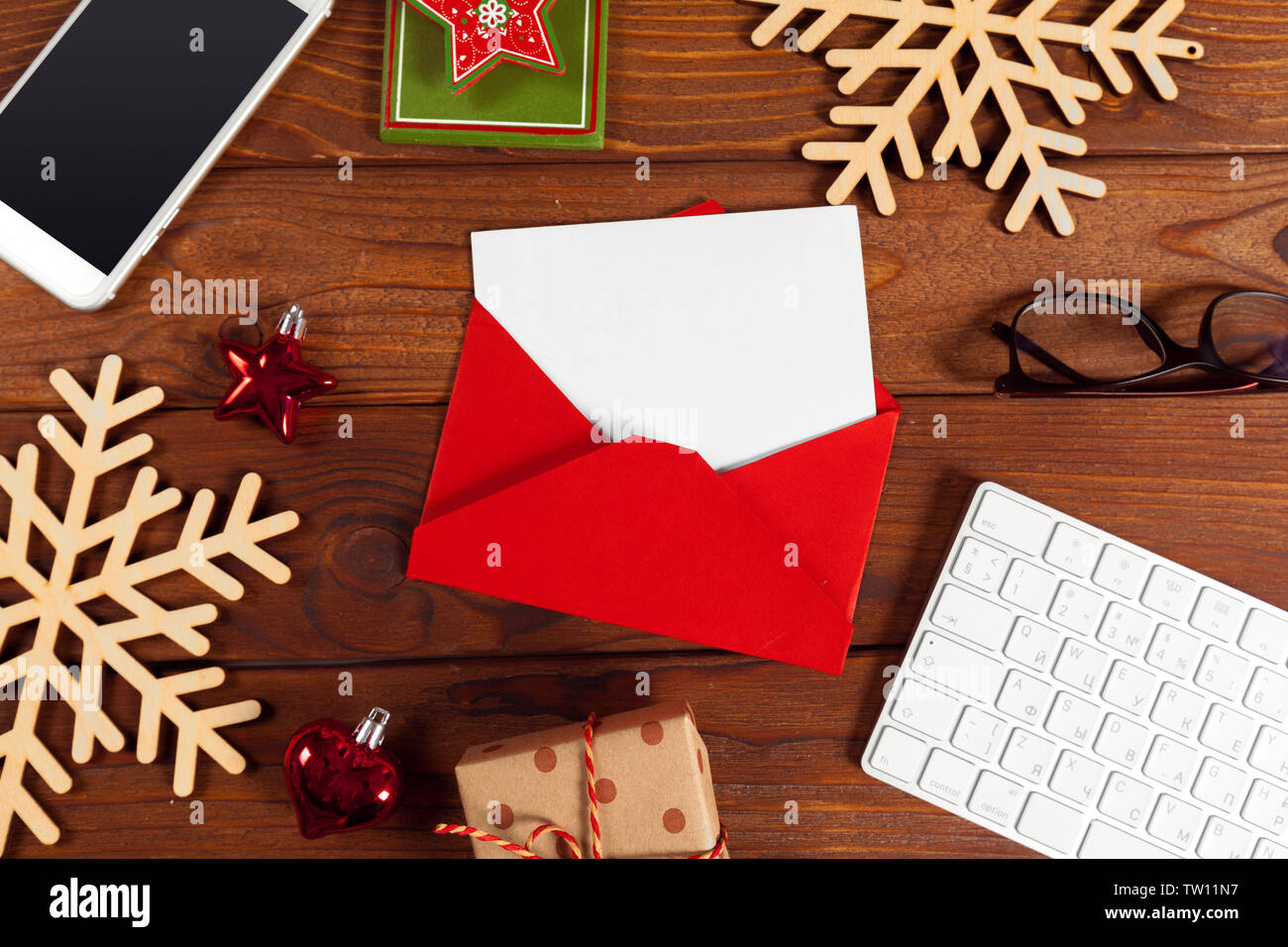 Greeting card and gift box on office table Stock Photo - Alamy