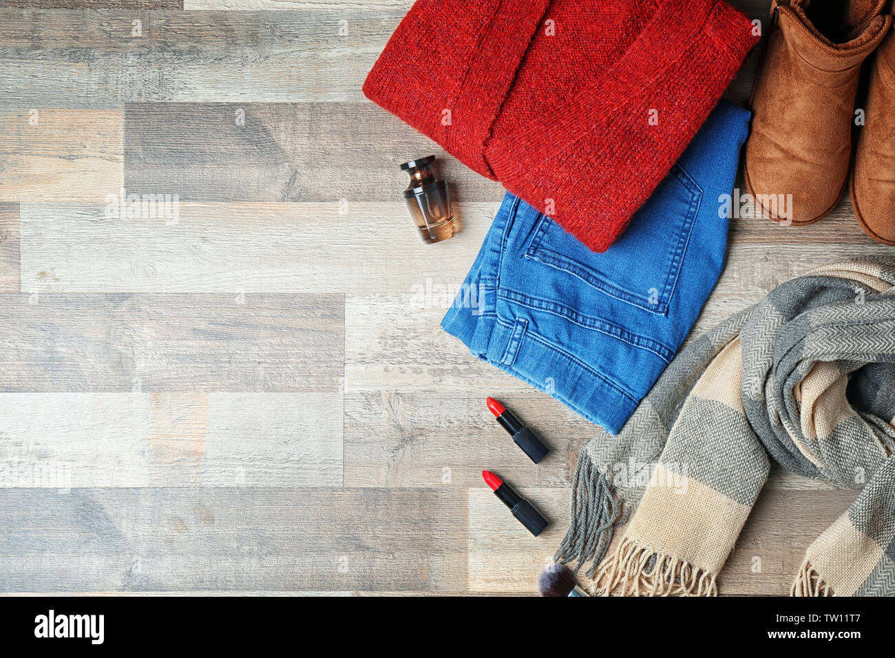 Set of female stylish clothes on wooden background Stock Photo - Alamy