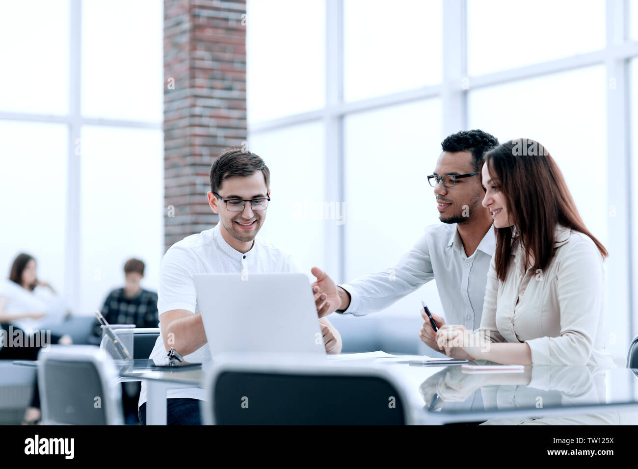 business team discussing online information at work meeting. people and ...